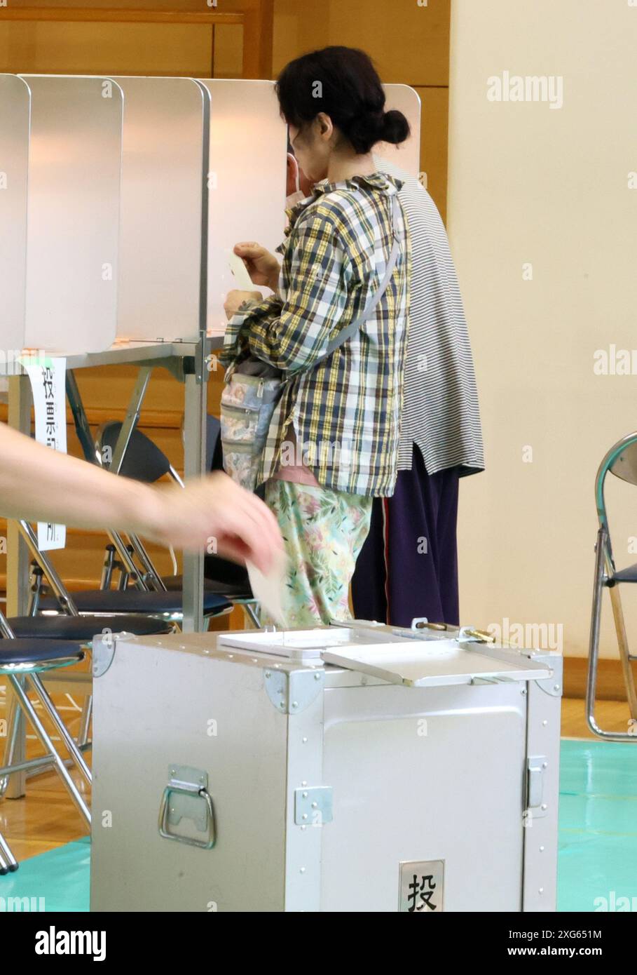 Tokyo, Japan. 7th July, 2024. Voters fill in ballot papers for the ...