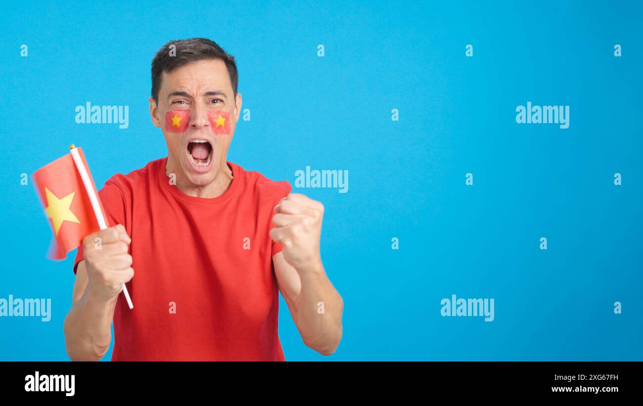 Man cheering for Vietnam screaming and waving a national flag Stock ...
