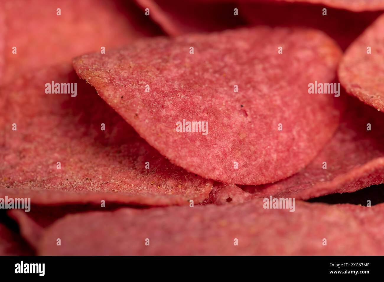 red potato chips with meat flavor, adding red dye to potato chips Stock ...