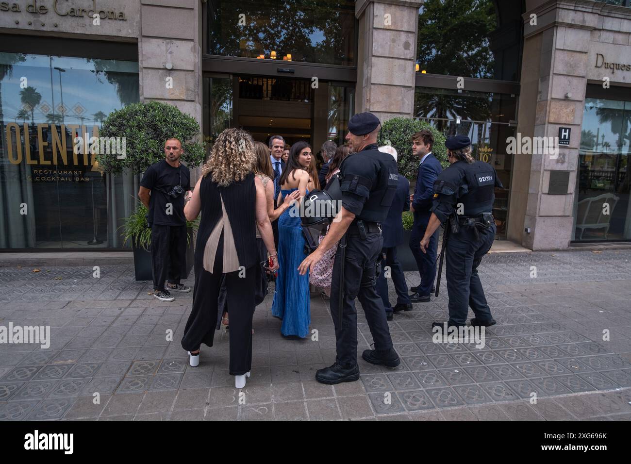 Regional police officers are seen alerting resident clients of a hotel ...