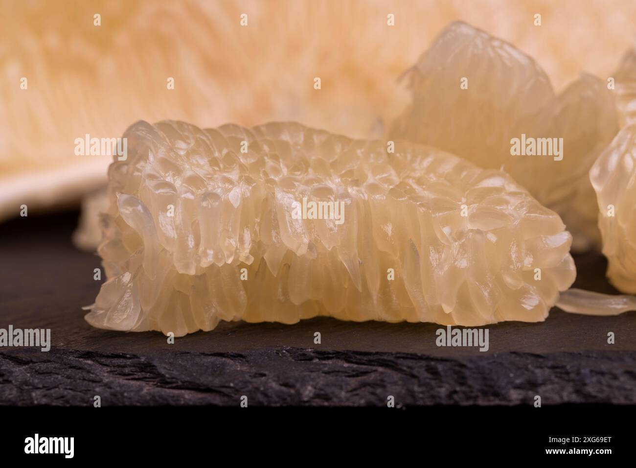 peeled pomelo slices in close-up, ripe and juicy pomelo without peel ...