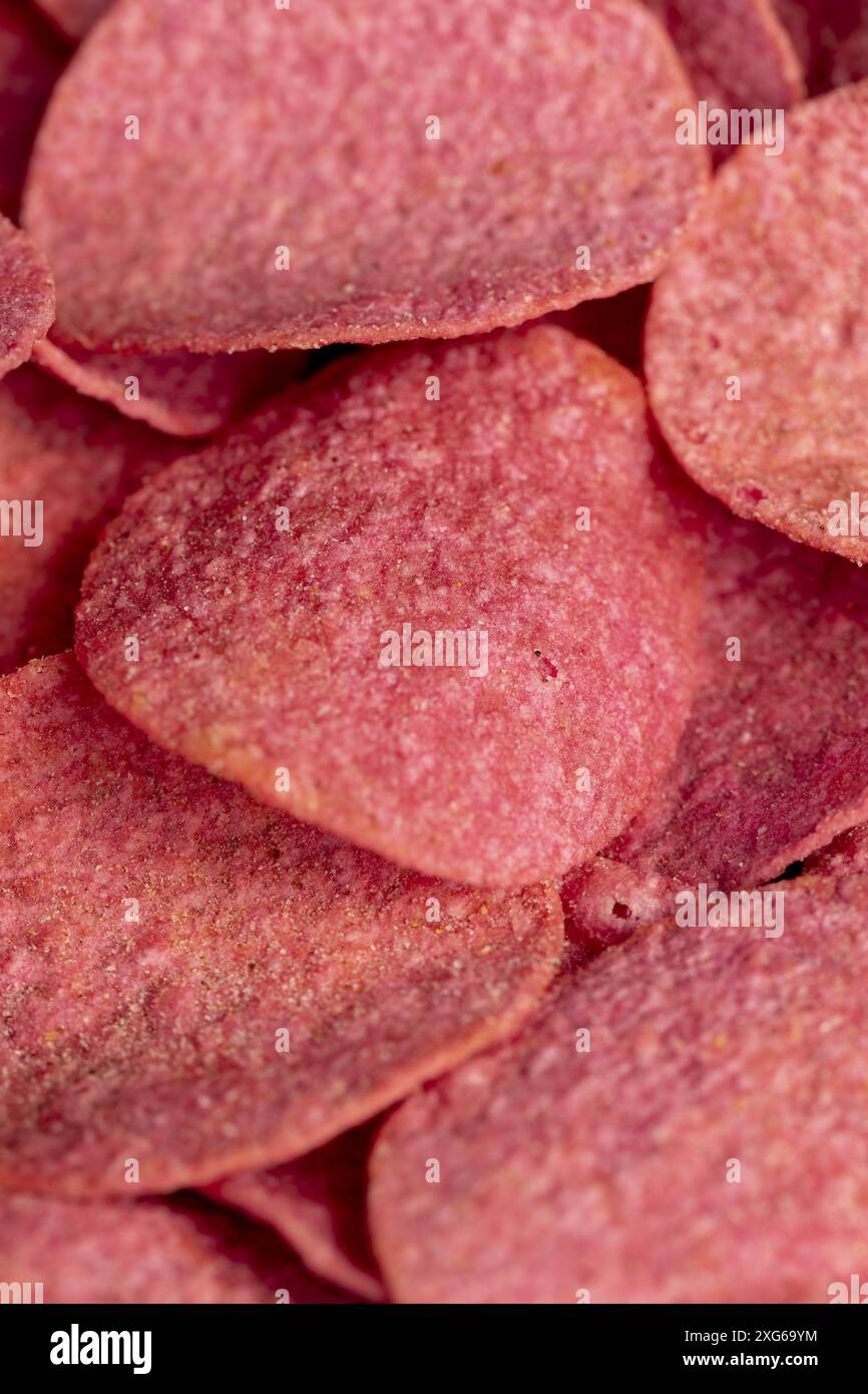 red potato chips with meat flavor, adding red dye to potato chips Stock ...
