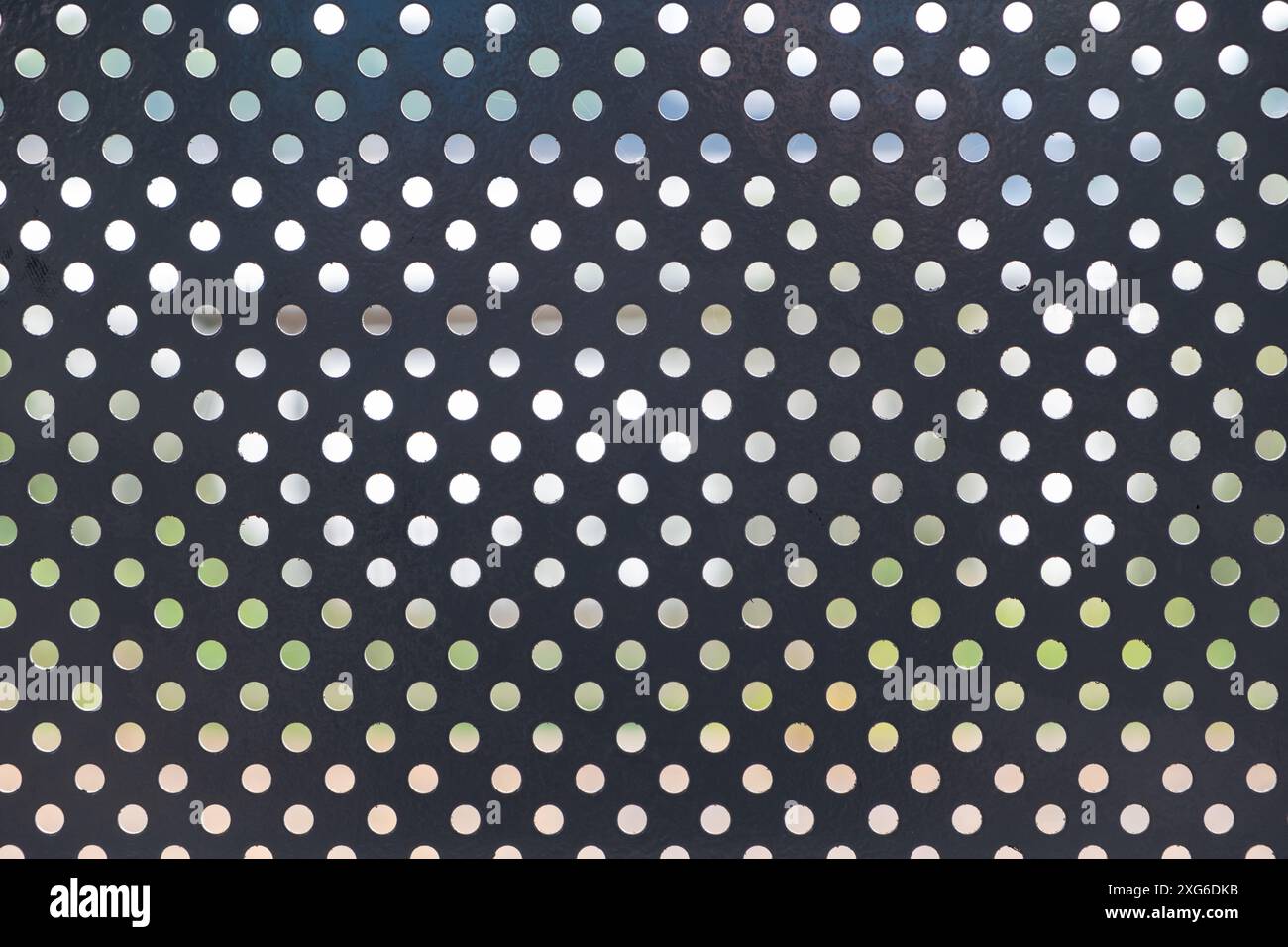 Pattern of small circular holes on a perforated metal surface Stock ...