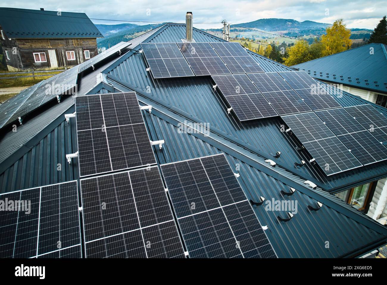 Photovoltaic solar panel system on the roof of house. Modern solar ...