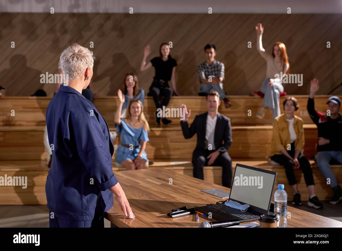 Students Audience raise hand up for asking the question in meeting room ...