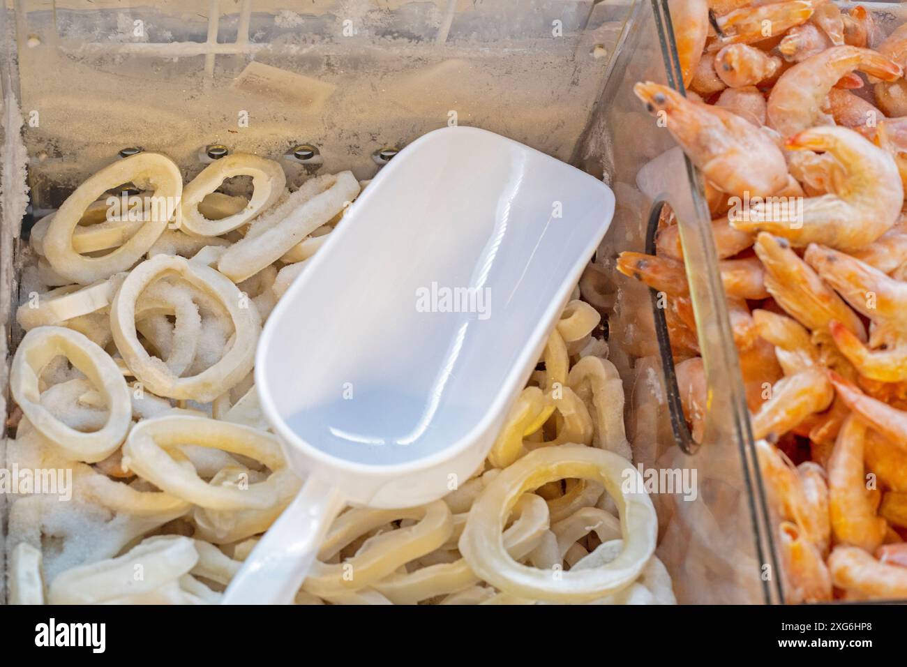 frozen squid with shrimp by weight in the supermarket Stock Photo - Alamy