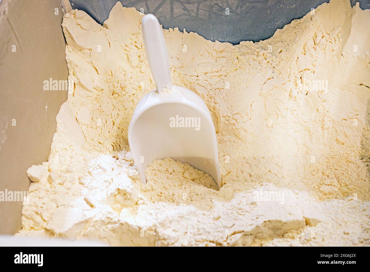 premium white wheat flour by weight in a supermarket. Savings and ...