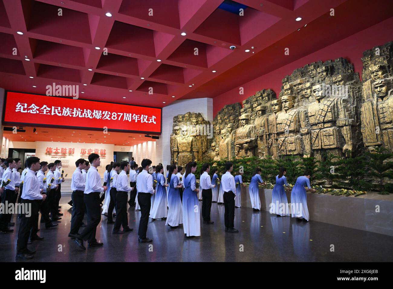 Beijing, China. 7th July, 2024. Attendees offer floral tributes to ...