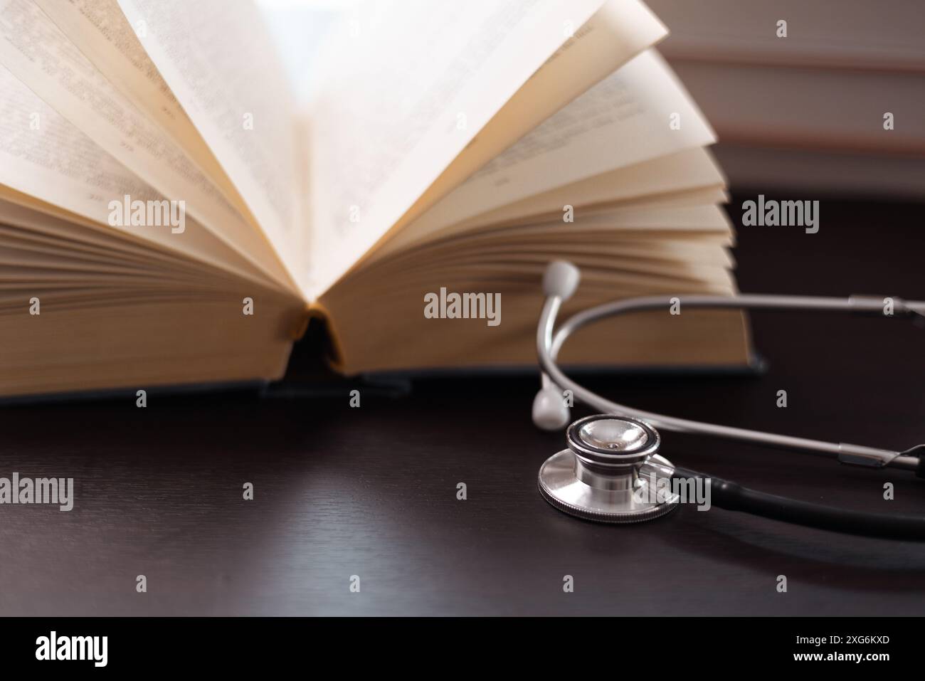 Surrounded by medical books and equipped with stethoscope, embodying ...