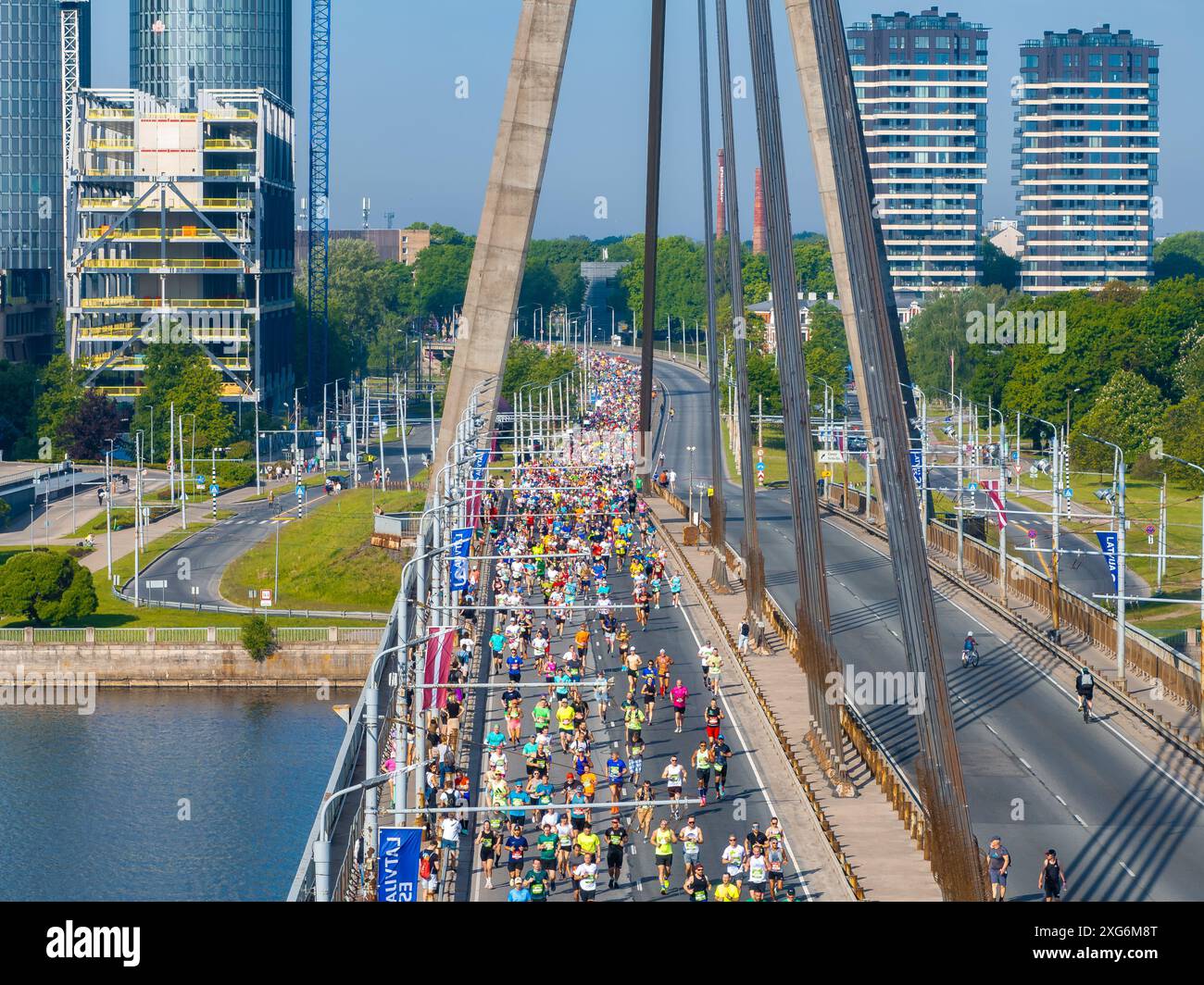 Aerial View of Marathon Runners Crossing Cable-Stayed Bridge in Riga ...