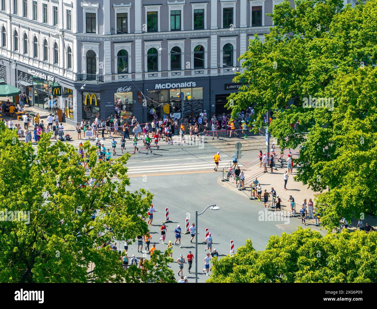 Aerial View of Marathon Runners Passing McDonald's in Riga, Latvia ...