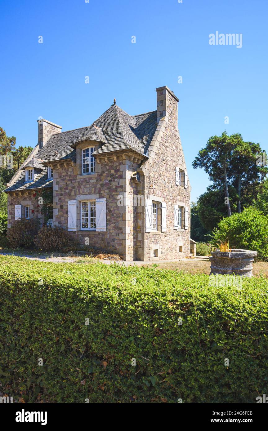 Traditional French country house in summer with a blue sky in Brittany ...