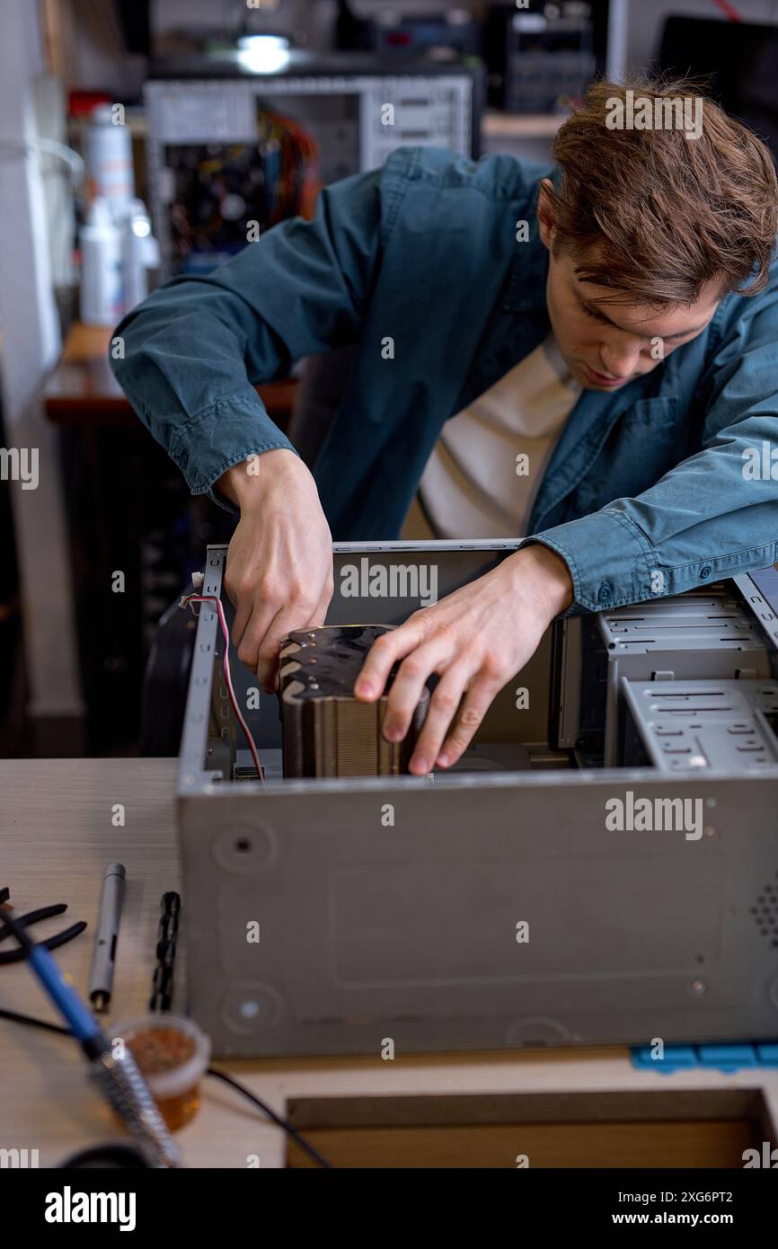 Person disassembles device motherboard in hi-res stock photography and ...