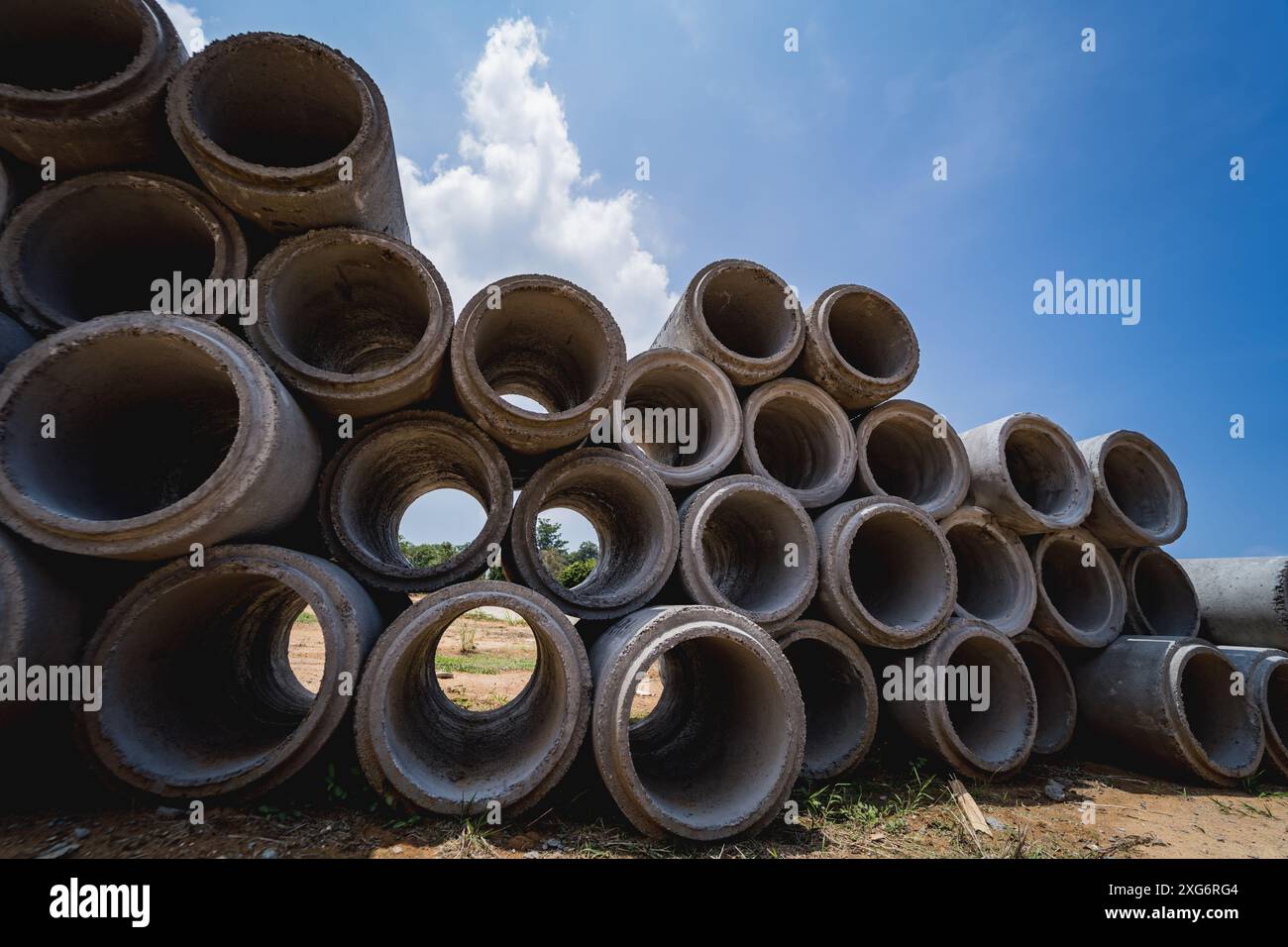 A stack of concrete ring pipes piled and creating a symmetrical ...