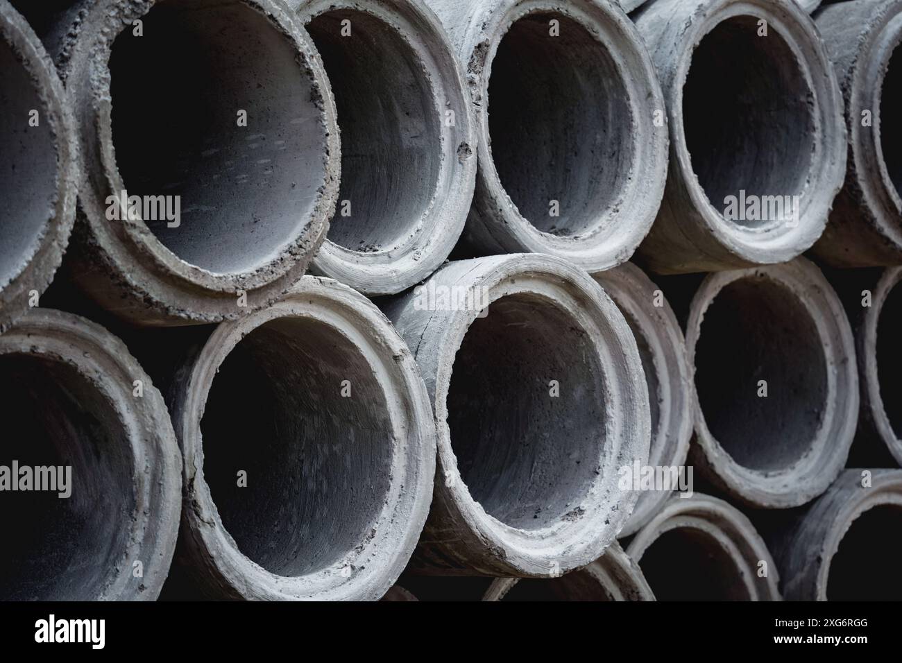 A stack of concrete ring pipes piled and creating a symmetrical ...