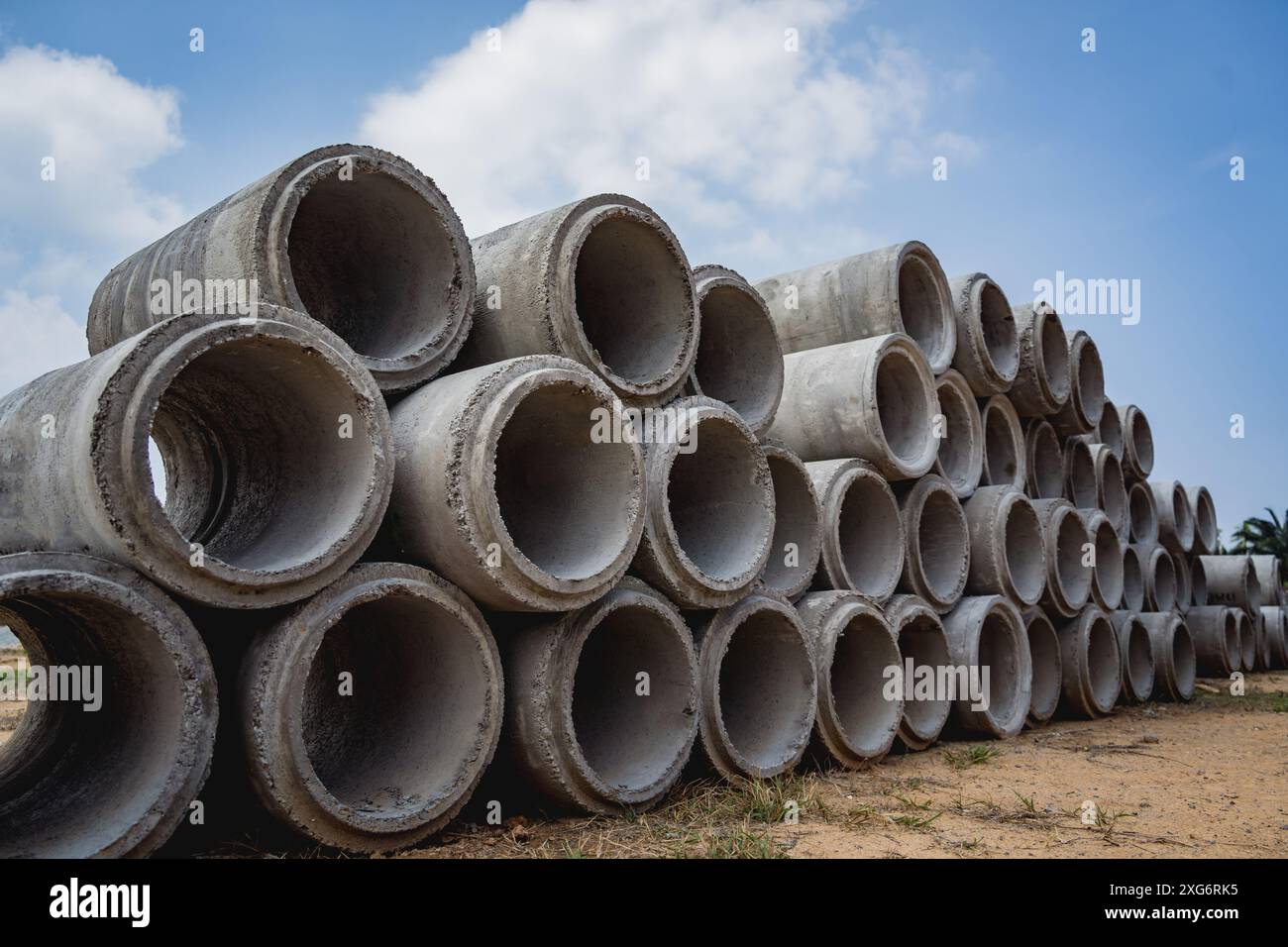 A stack of concrete ring pipes piled and creating a symmetrical ...