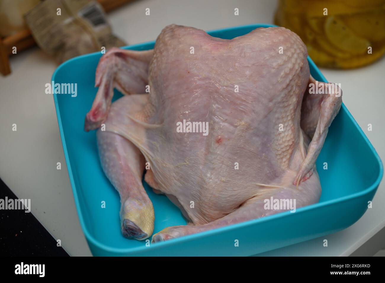chicken washed before cooking in a tray in the kitchen 7 Stock Photo ...