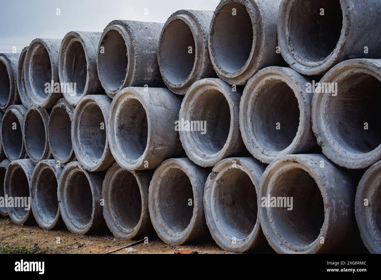 A stack of concrete ring pipes piled and creating a symmetrical ...
