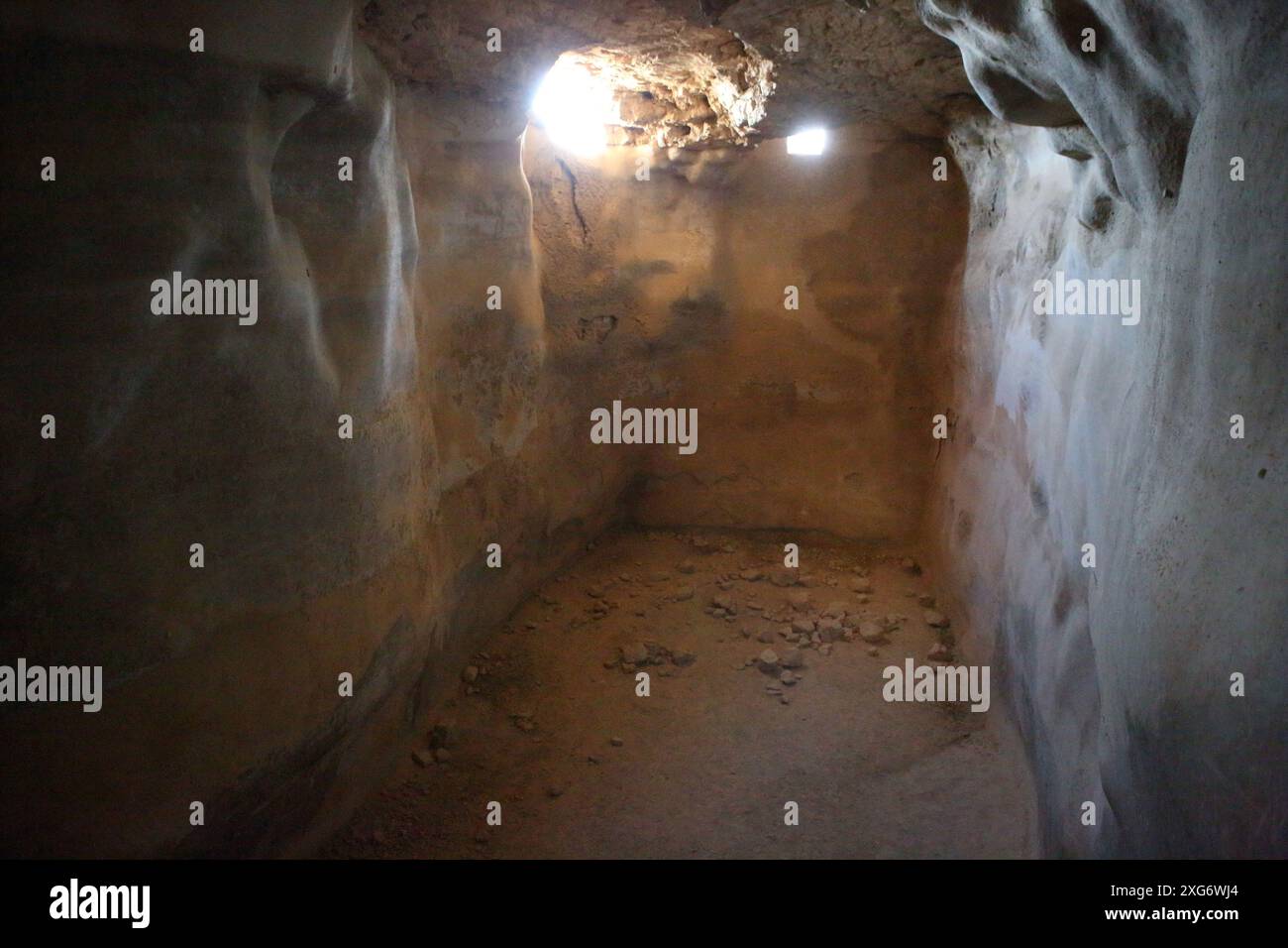 Light comes through a hole in the ceiling of a big water cistern ...
