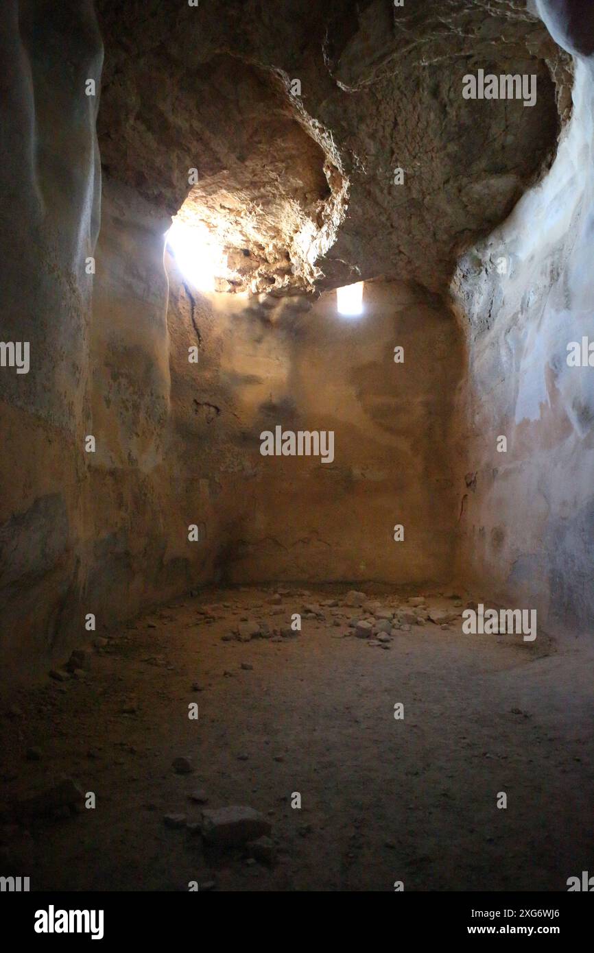 Light comes through a hole in the ceiling of a big water cistern ...