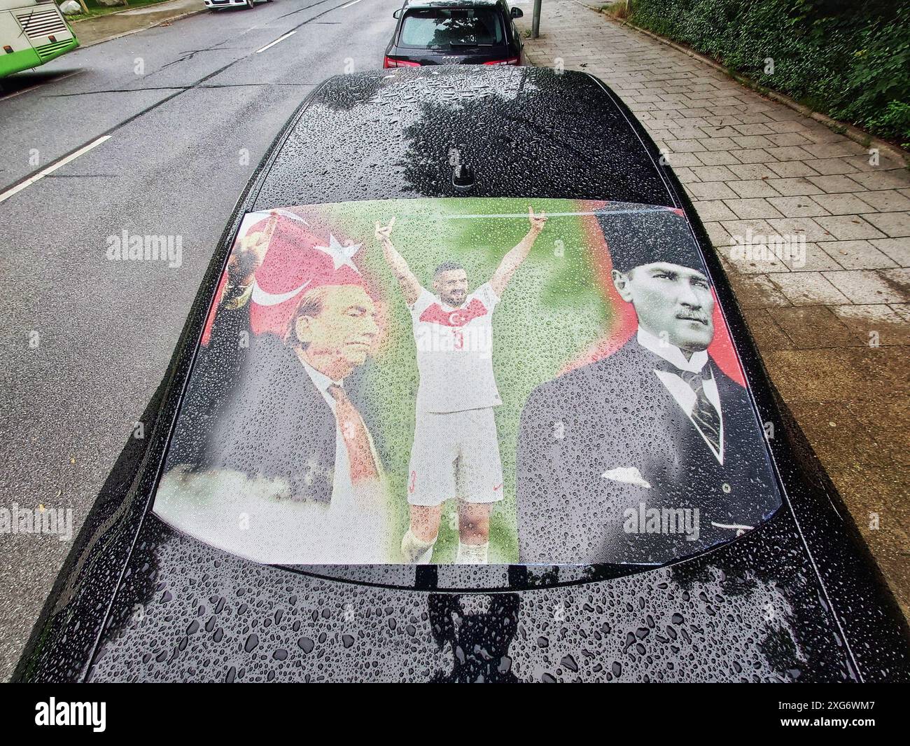 Munich, Bavaria, Germany. 7th July, 2024. A banner covering a car's ...