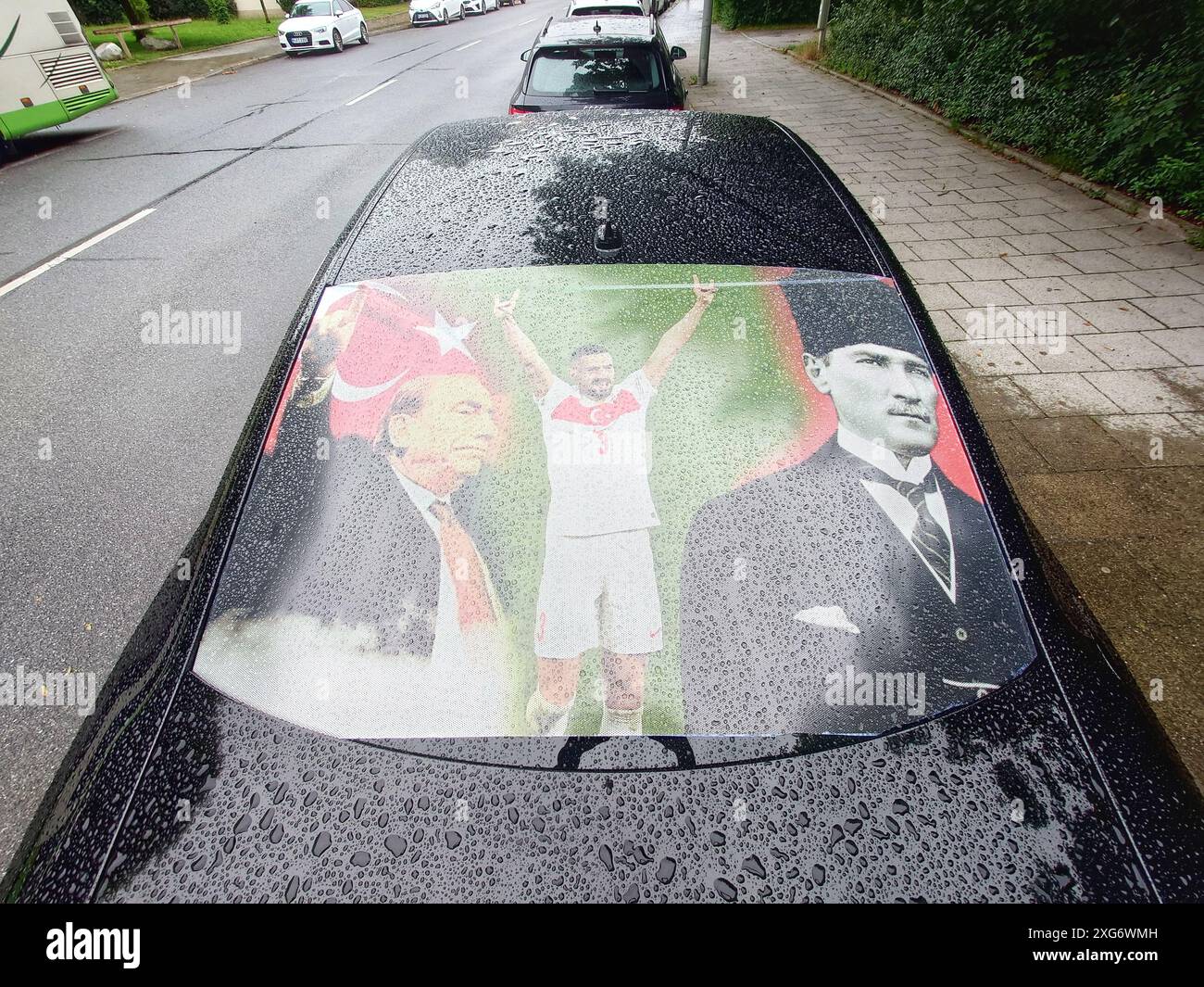 Munich, Bavaria, Germany. 7th July, 2024. A banner covering a car's ...
