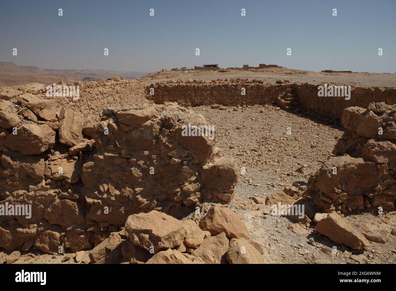 Ruins of a large Swimming Pool built in the desert fort of Masada by ...