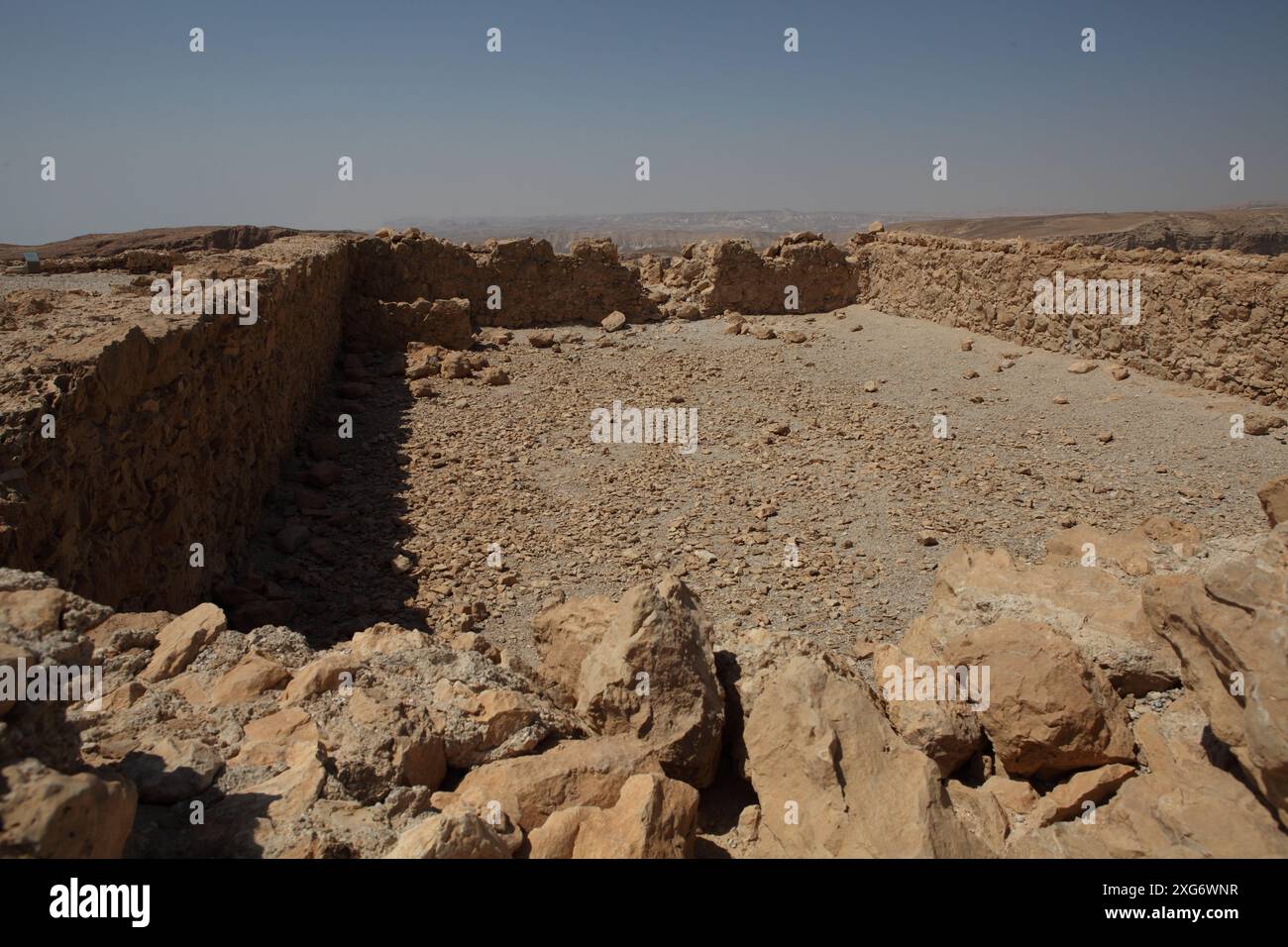 Ruins of a large Swimming Pool built in the desert fort of Masada by ...