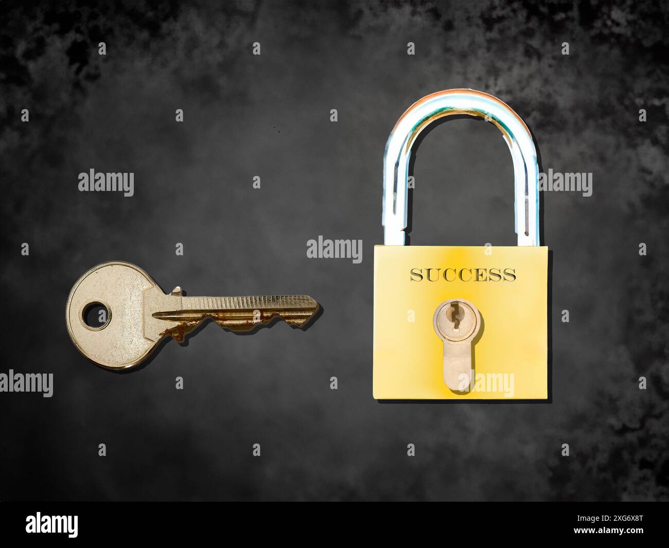 A Key and padlock. Success is engraved into the padlock Stock Photo - Alamy