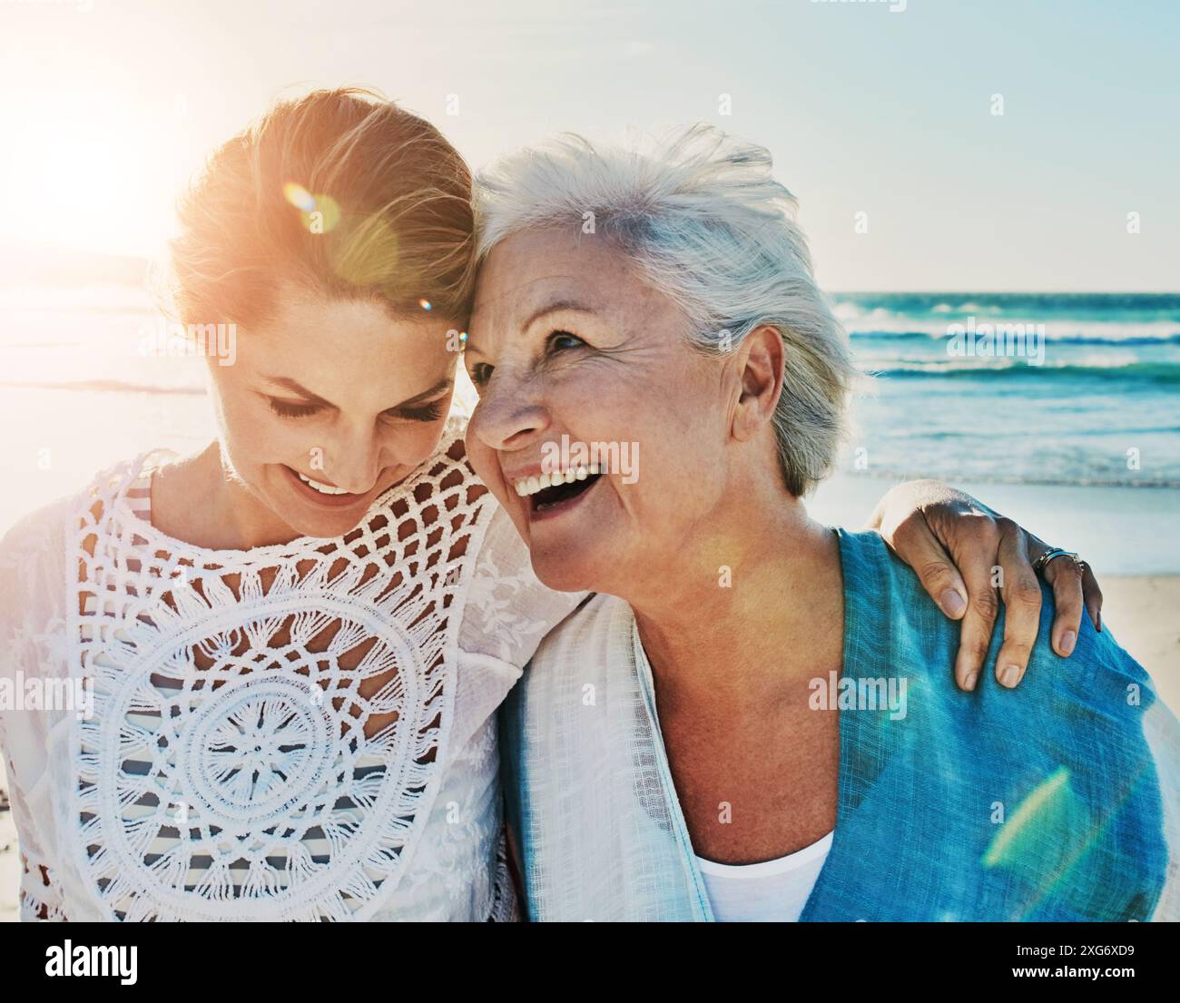 Senior mother, daughter and bonding hug on beach, family and travel ...