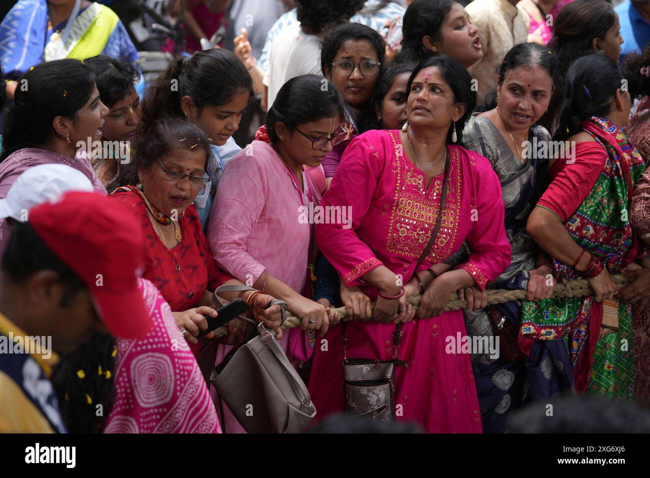 Hindu devotees pull a rath, or chariot, during the annual Rath Yatra ...