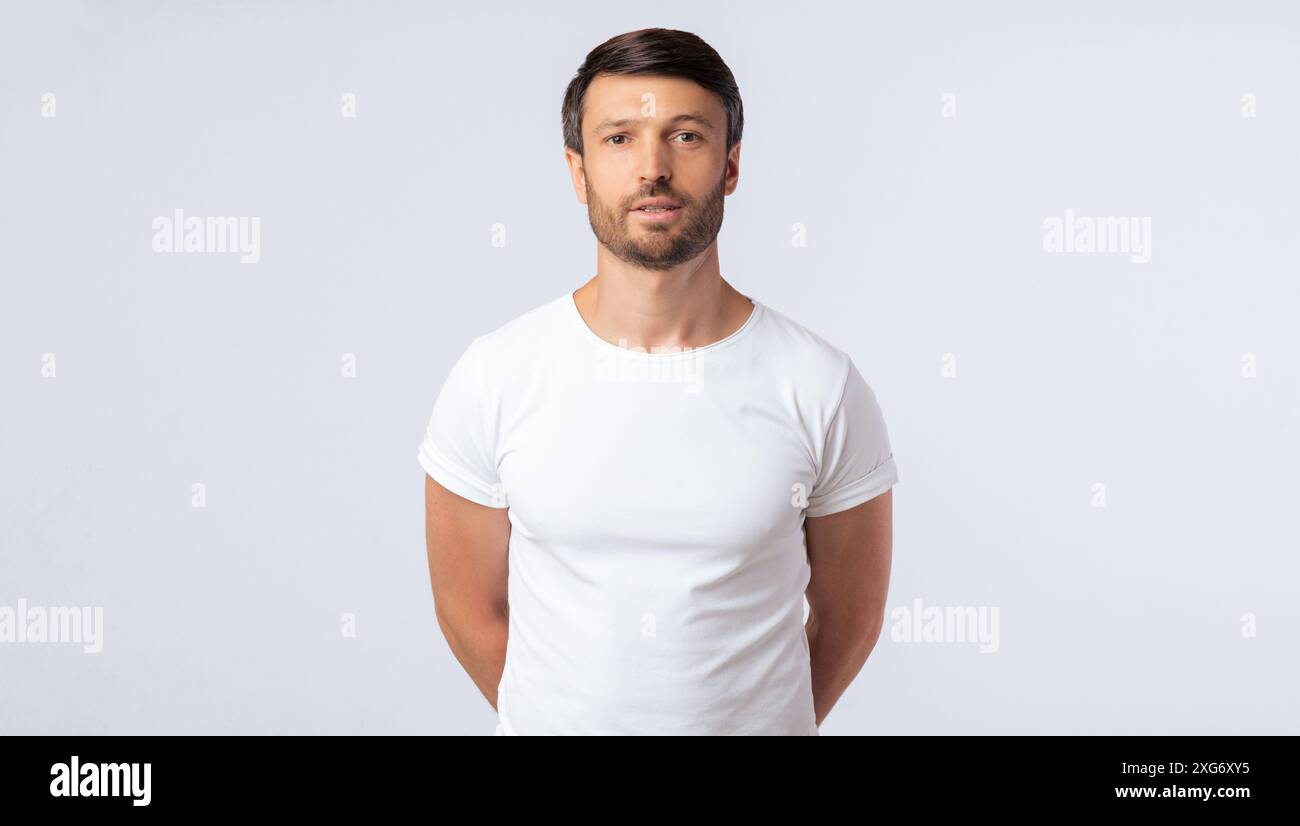 Man Standing With Hands Behind Back Looking At Camera, Isolated Stock ...