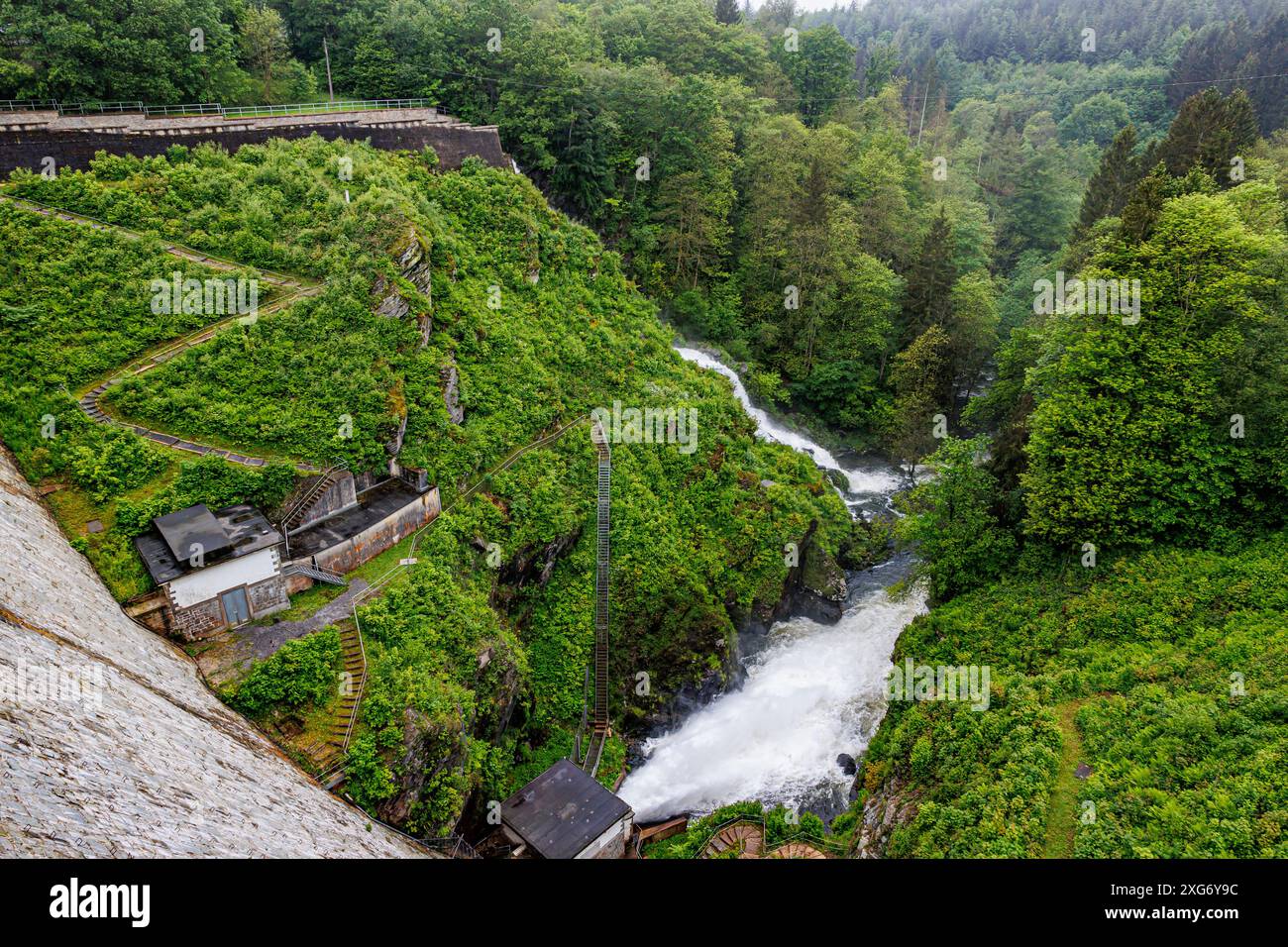 Water coming out at high pressure from Robertville Dam, stairs on slope ...