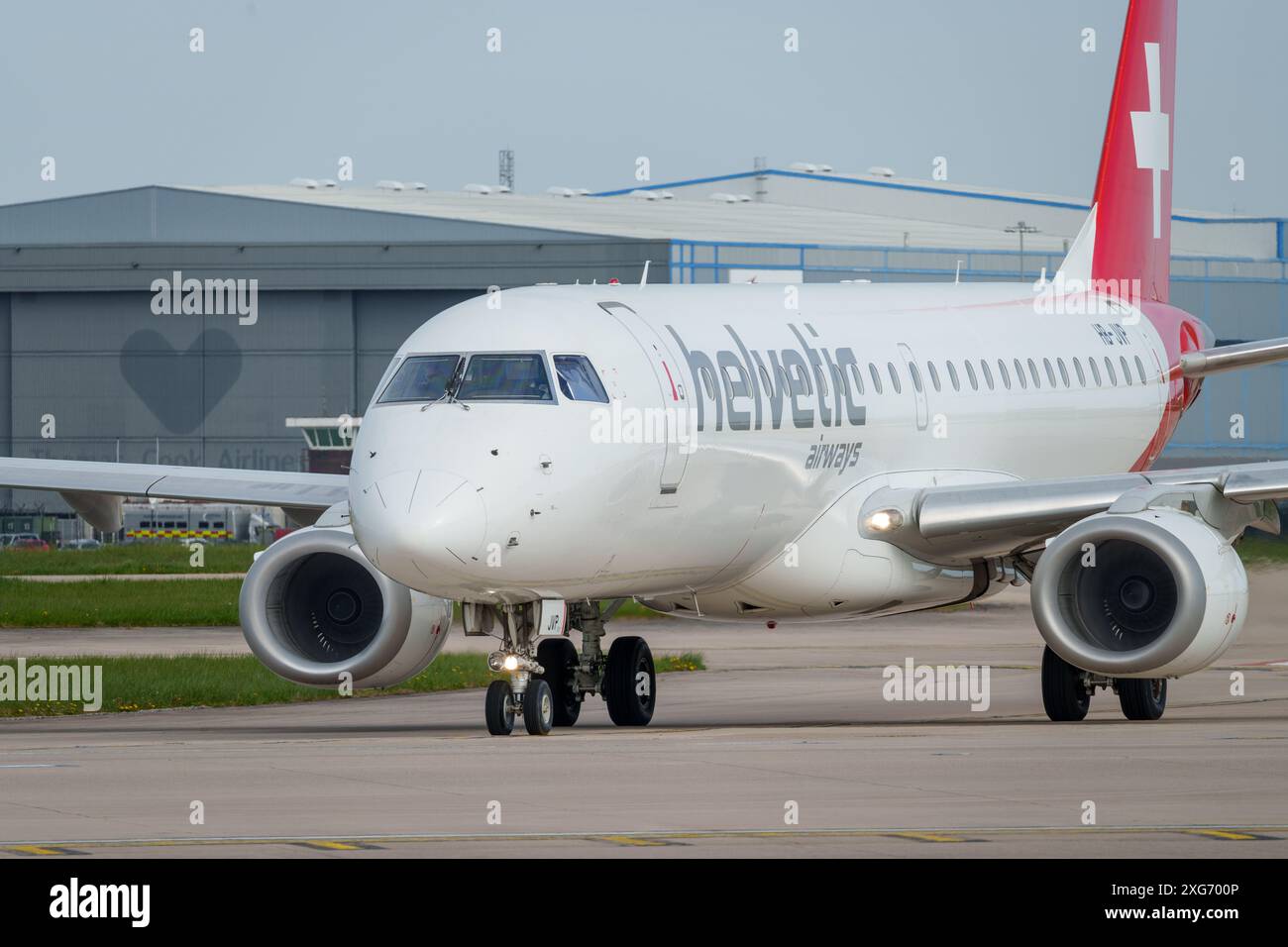 Helvetic Airways Embraer E190LR departing Manchester for Zurich Stock ...