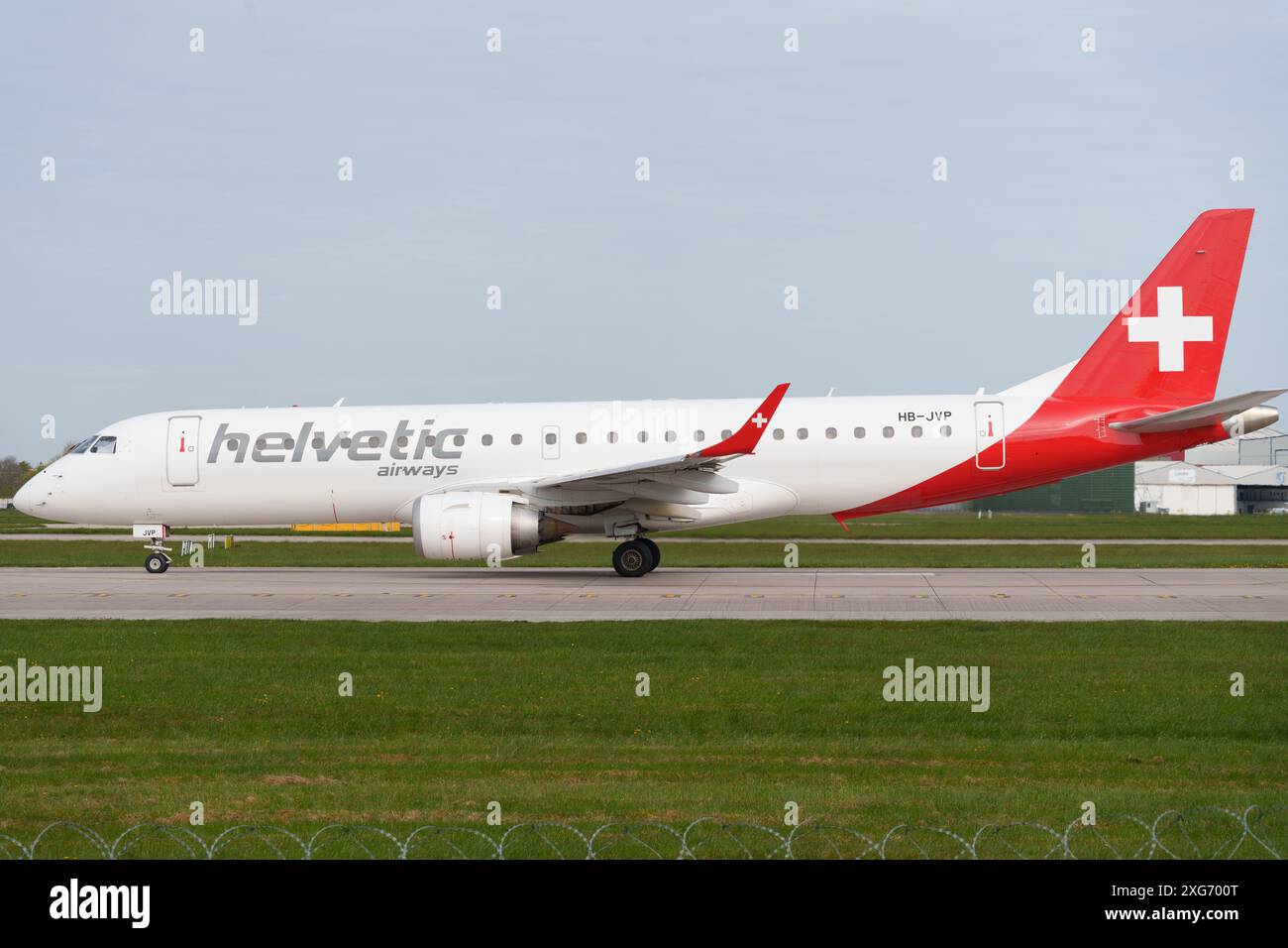 Helvetic Airways Embraer E190LR departing Manchester for Zurich Stock ...