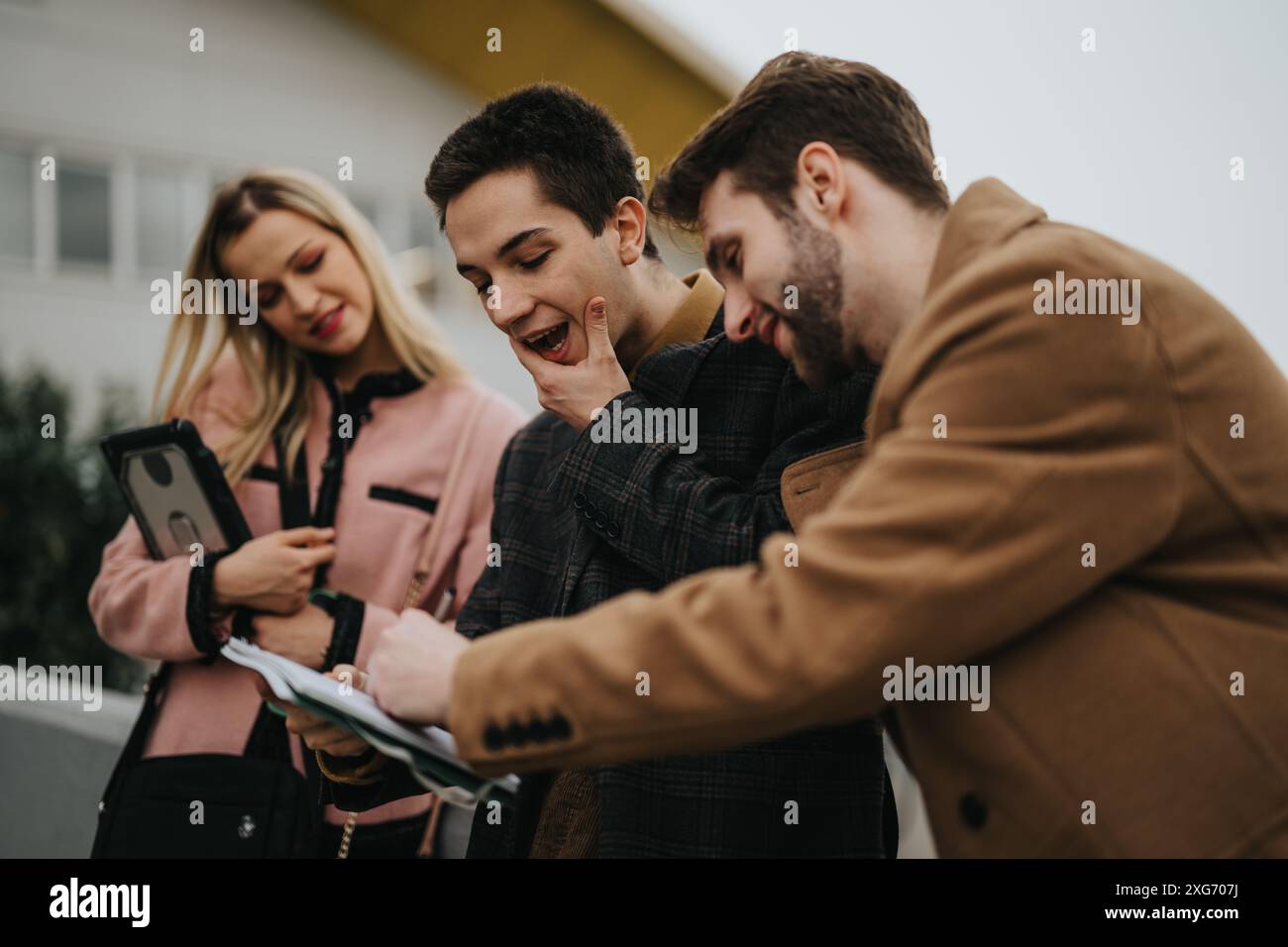 Young professionals engaging in an outdoor marketing strategy meeting ...