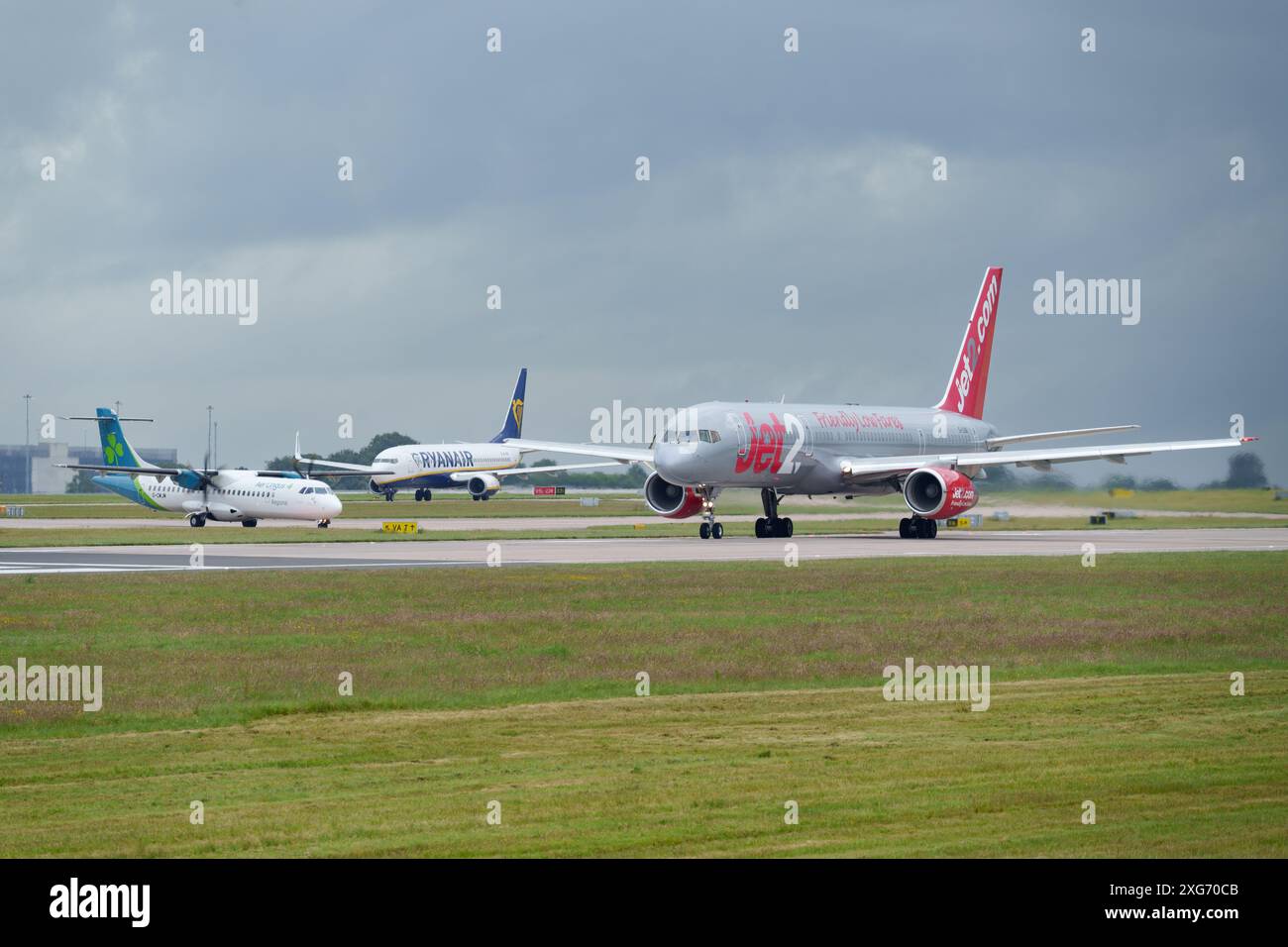 Short and medium haul aircraft taxiing for departure at Manchester ...