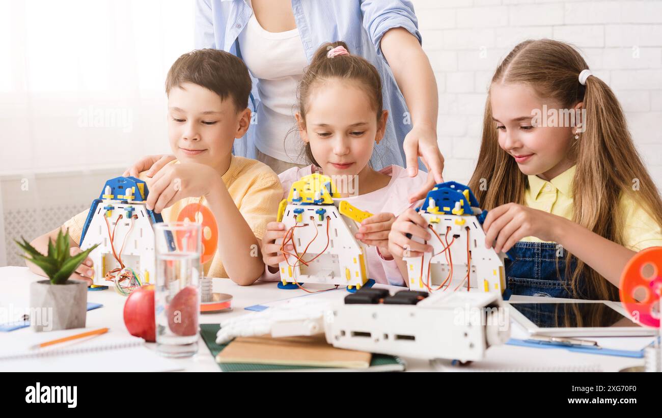 Young Students Building Robots in Classroom Setting Stock Photo - Alamy
