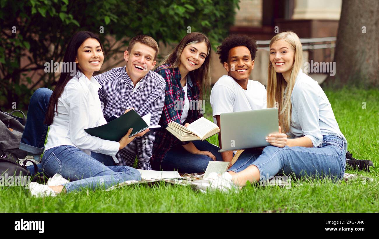 University students resting in campus, smiling to camera Stock Photo ...