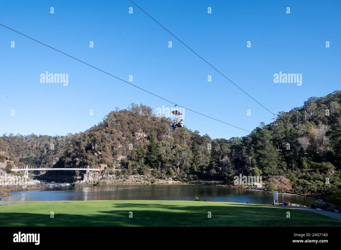 A chain of chair lifts crossing a lake with the Alexandra suspension ...