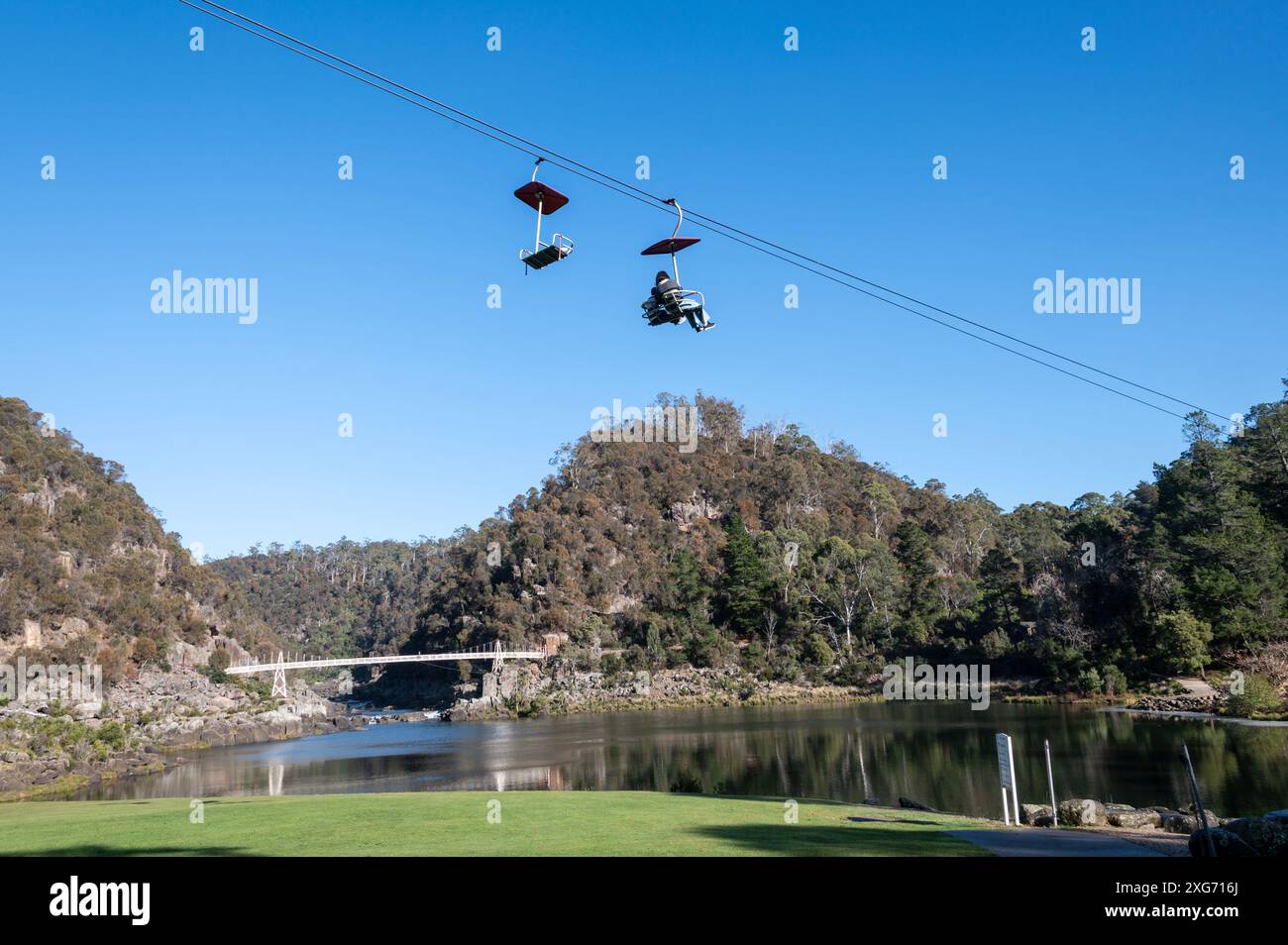 A chain of chair lifts crossing a lake with the Alexandra suspension ...