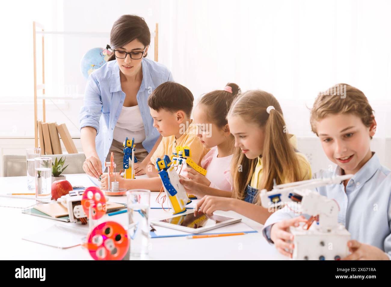 Young Students Learning Robotics and Building Robots in Classroom ...