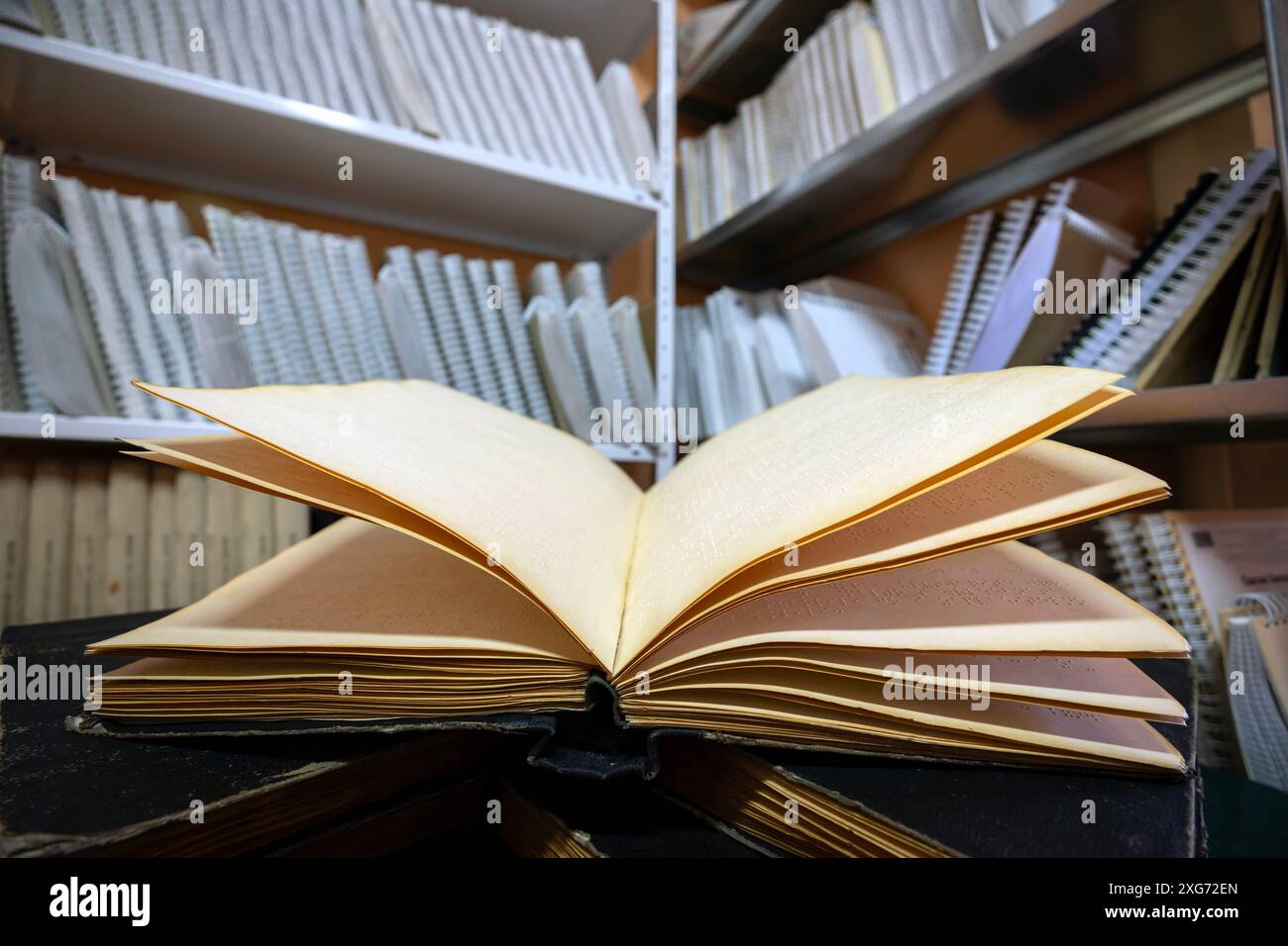 Braille is a system of reading and writing by touch used by the blind ...