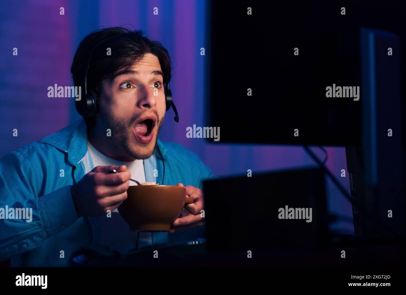 Shocked Gamer Eating Cereal While Watching Computer Screen At Night ...