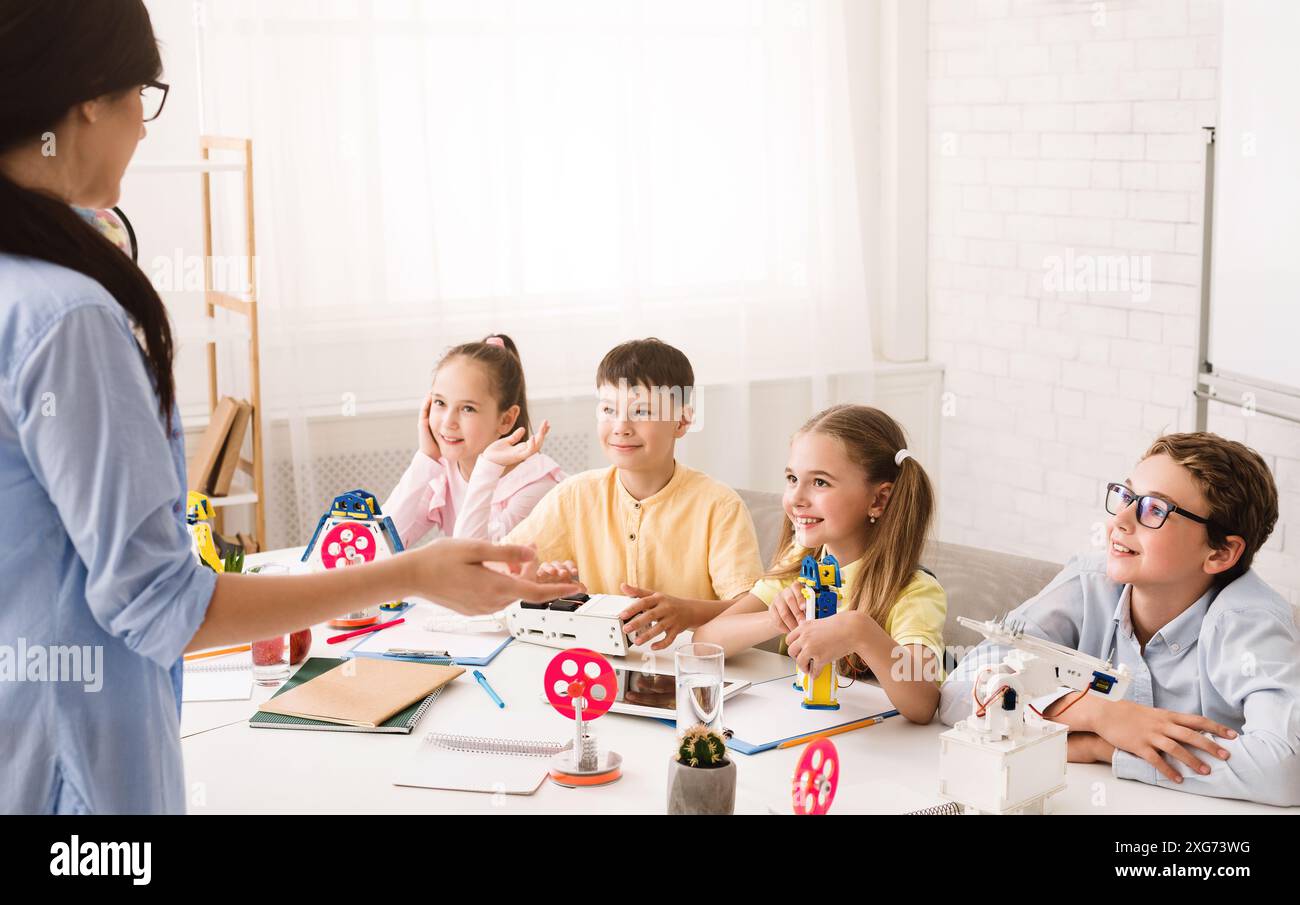 Teacher Leading Young Students in a STEM Classroom Activity Stock Photo ...