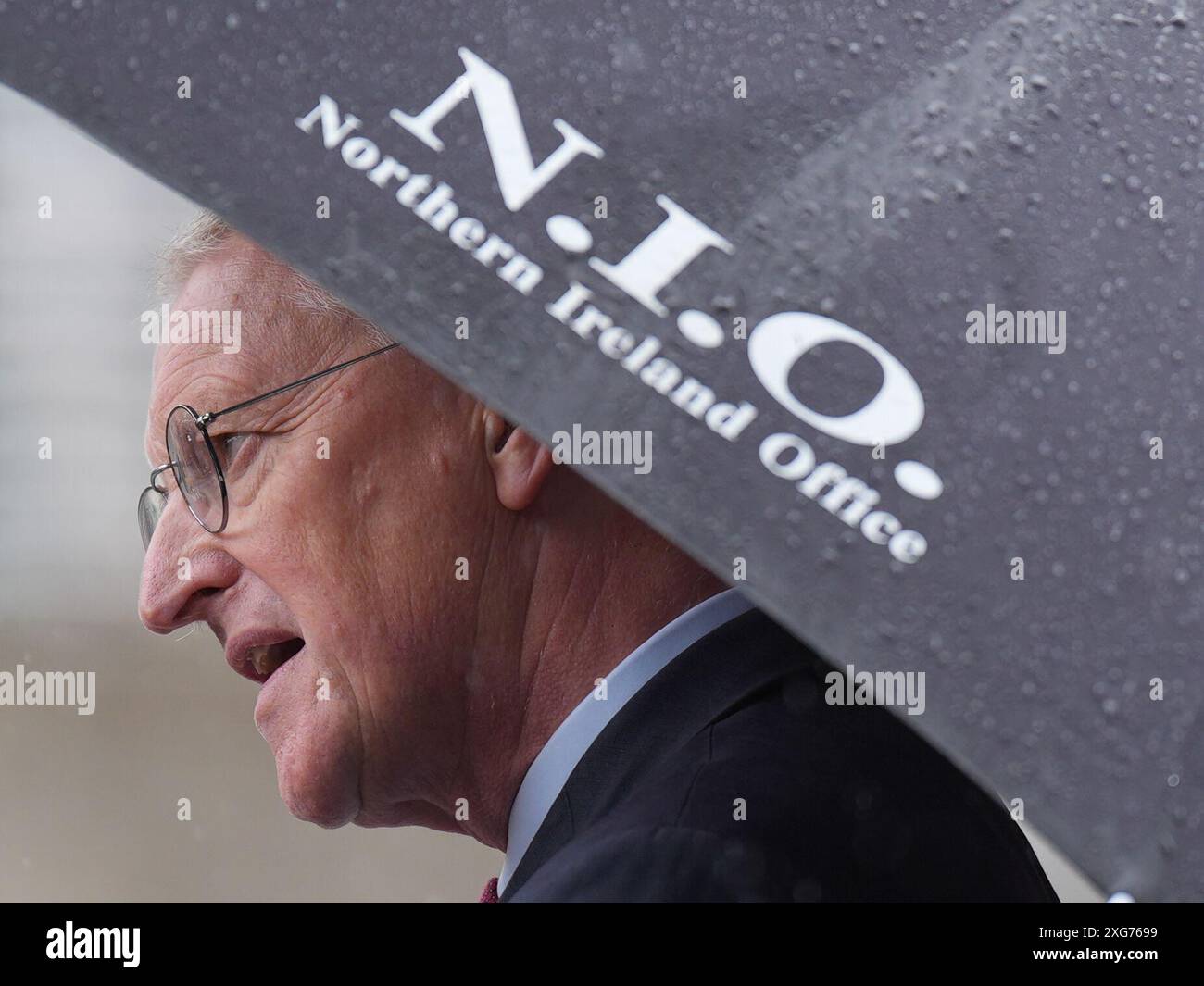 Northern Ireland Secretary Hilary Benn speaks to the media outside ...
