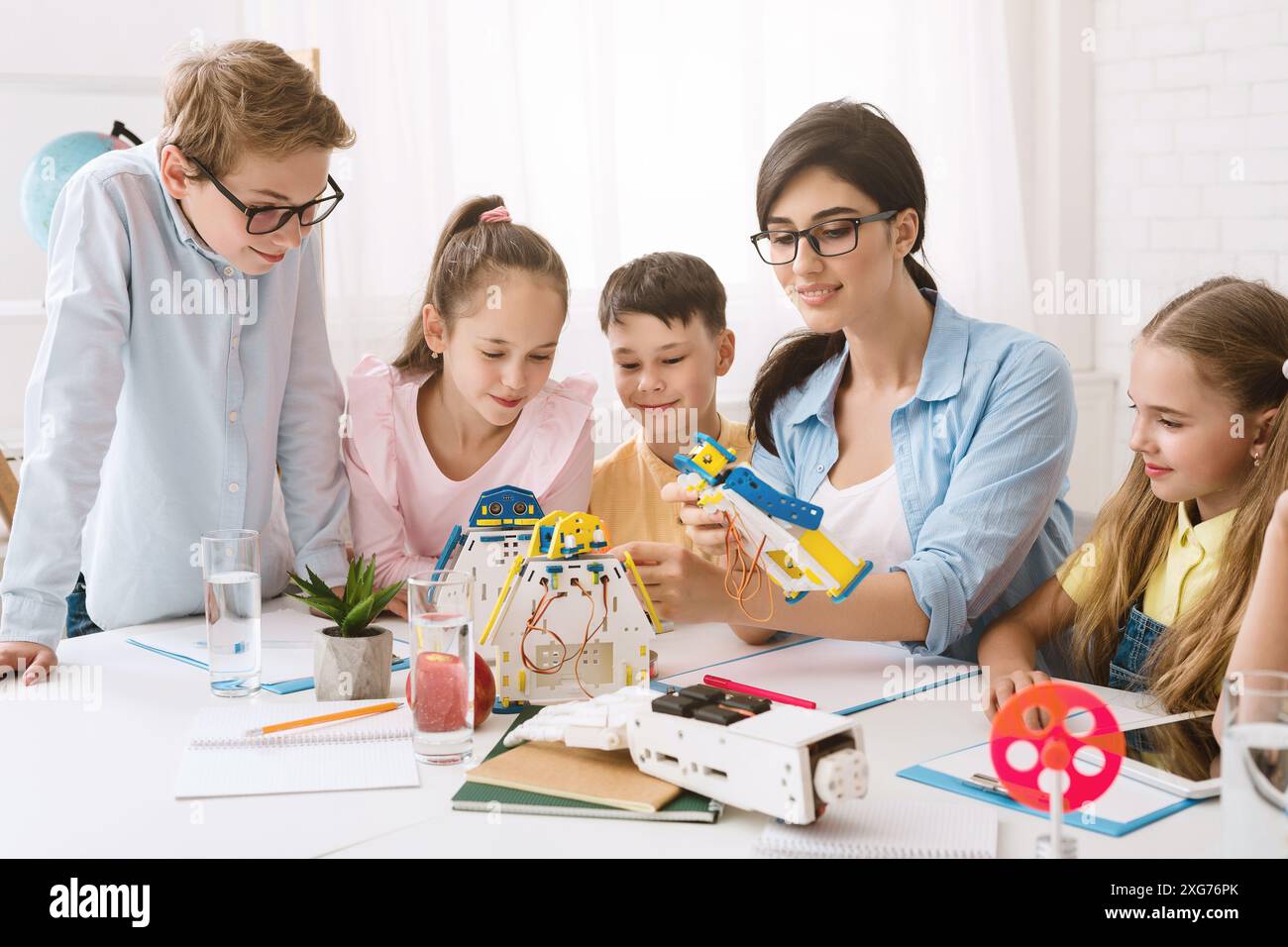 Young Students Building Robot During STEM Class Stock Photo - Alamy