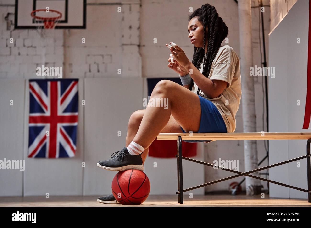 Side view portrait of young Black woman as female basketball player ...