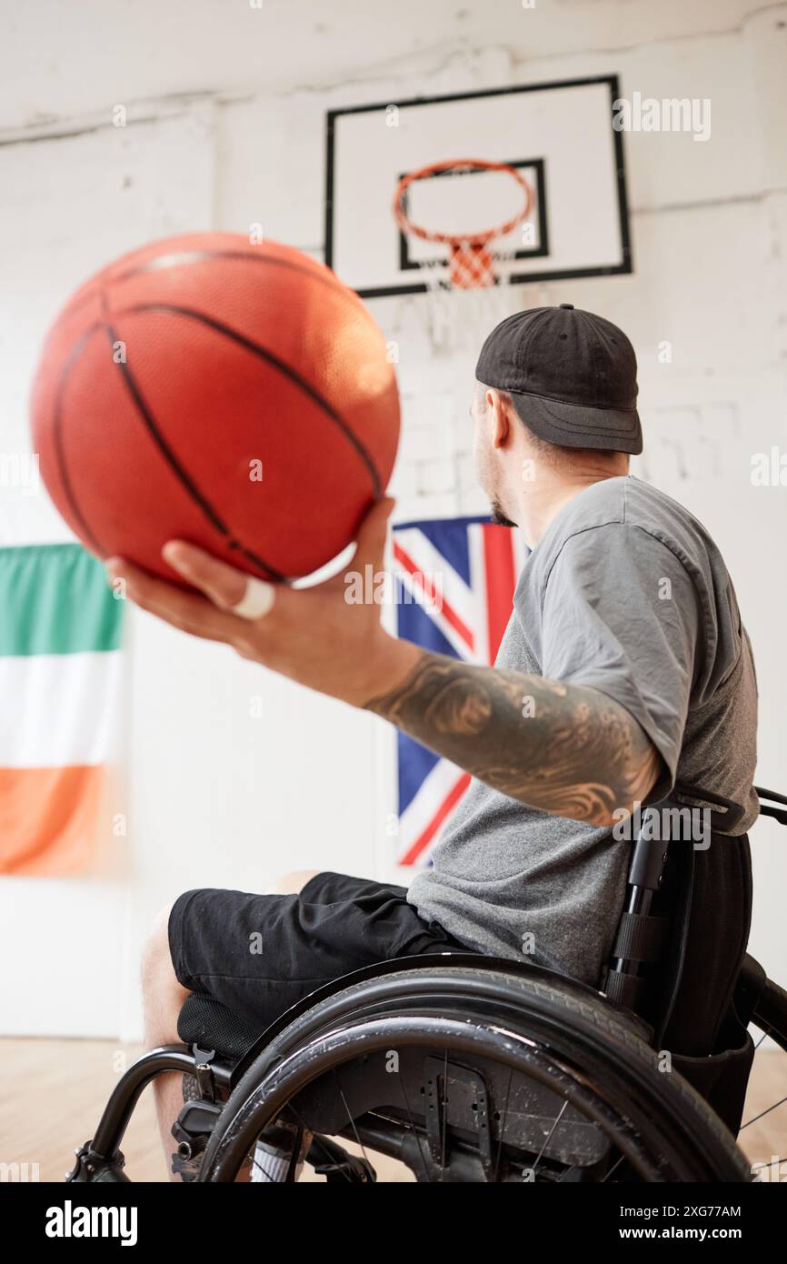 Forced perspective shot of young sportsman with disability throwing ...