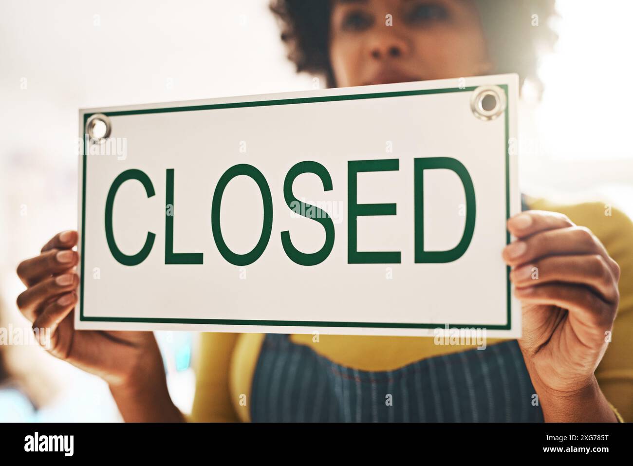 Closed sign and door of coffee shop, person and hands of waitress with ...